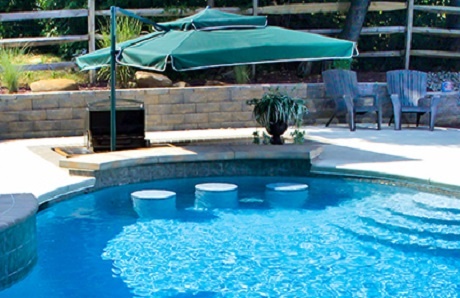 What is a Swim-Up Pool Bar?—and How to Add One to Your Backyard