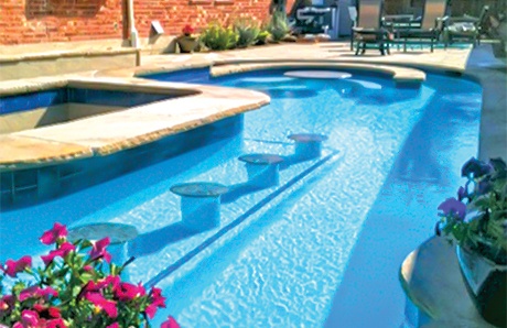 What is a Swim-Up Pool Bar?—and How to Add One to Your Backyard