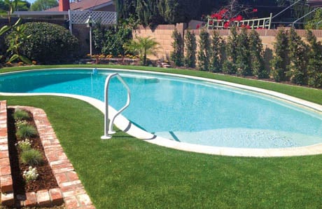 Swimming Pool “Decks” Using Grass Lawns—in Photos