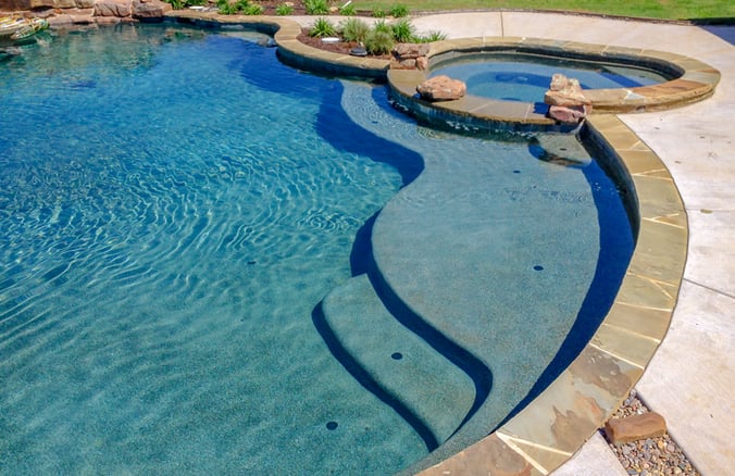 12 Clever Ways for Integrating Stone into Pools—In Photos