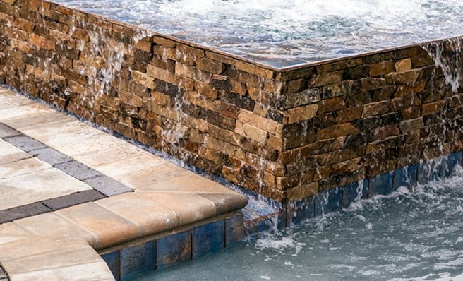 What is a rim flow spa on a custom swimming pool? (with design photos)