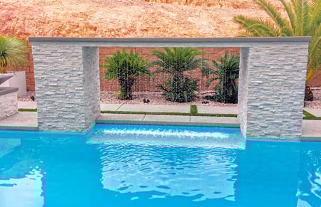 What is a rain curtain water feature on a swimming pool?