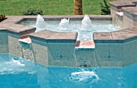 10 Swimming Pool Water Feature Ideas (Besides Rock Waterfalls)