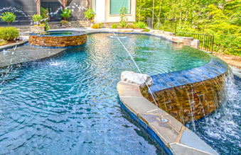 12 Clever Ways for Integrating Stone into Pools—In Photos