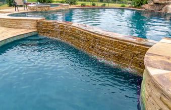 12 Clever Ways for Integrating Stone into Pools—In Photos