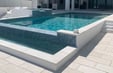 What is a reverse infinity-edge swimming pool?