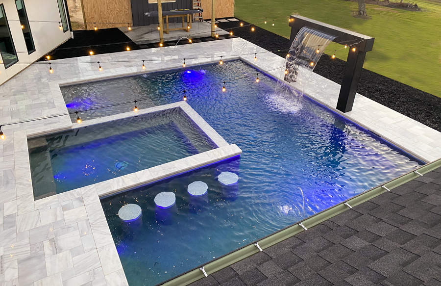 What is a rain curtain water feature on a swimming pool?