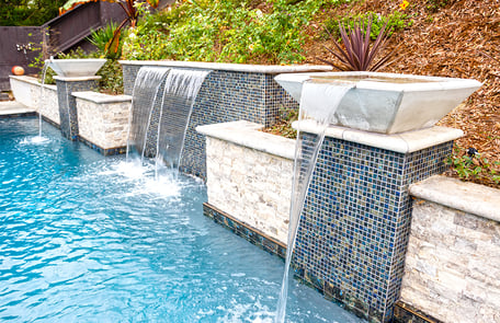 10 Swimming Pool Water Feature Ideas (Besides Rock Waterfalls)