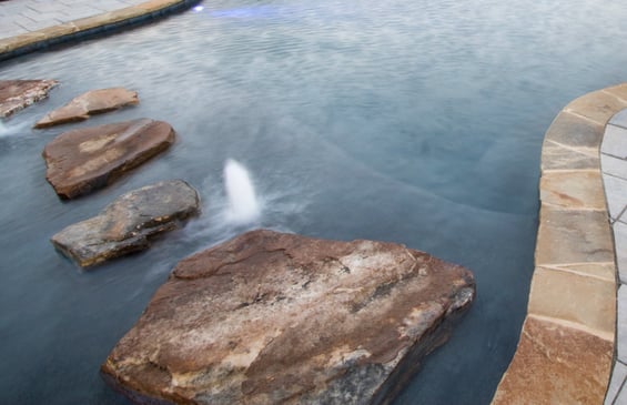 12 Clever Ways for Integrating Stone into Pools—In Photos