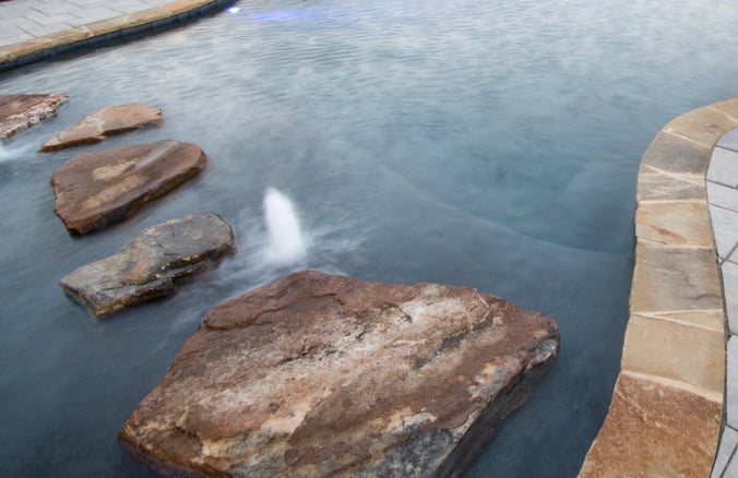 12 Clever Ways for Integrating Stone into Pools—In Photos